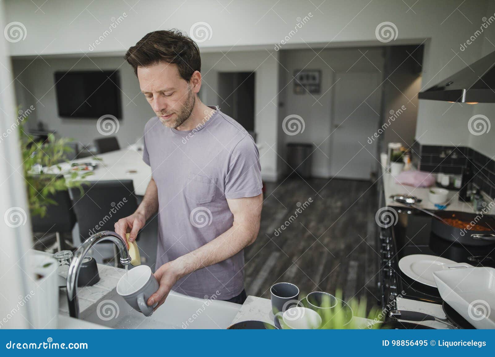 Man Doing Dishes at Home stock image. Image of culture - 98856495