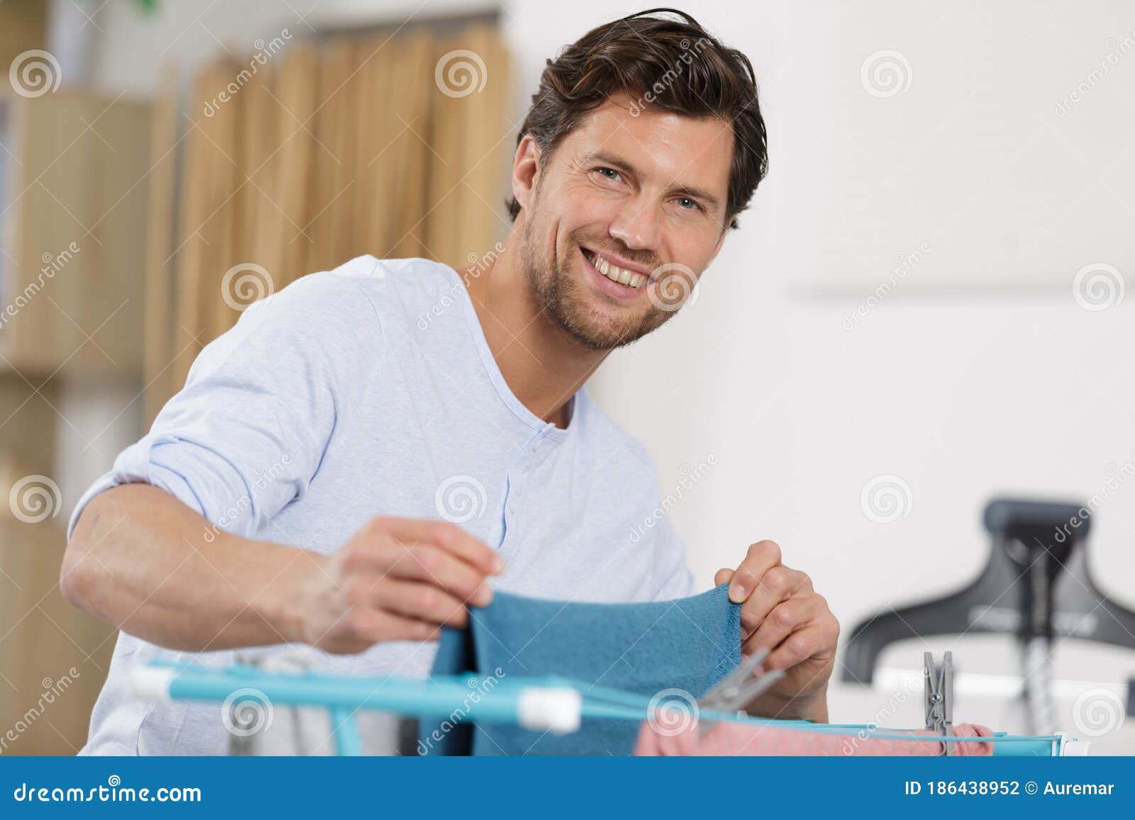 Man Doing Drying Cloths at Home Stock Photo - Image of housework ...
