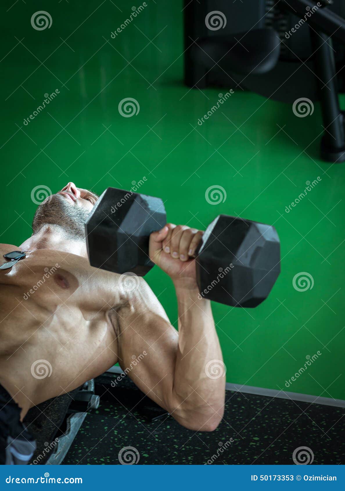 Man Doing Dumbbell Press while Lying Down Stock Image - Image of ...
