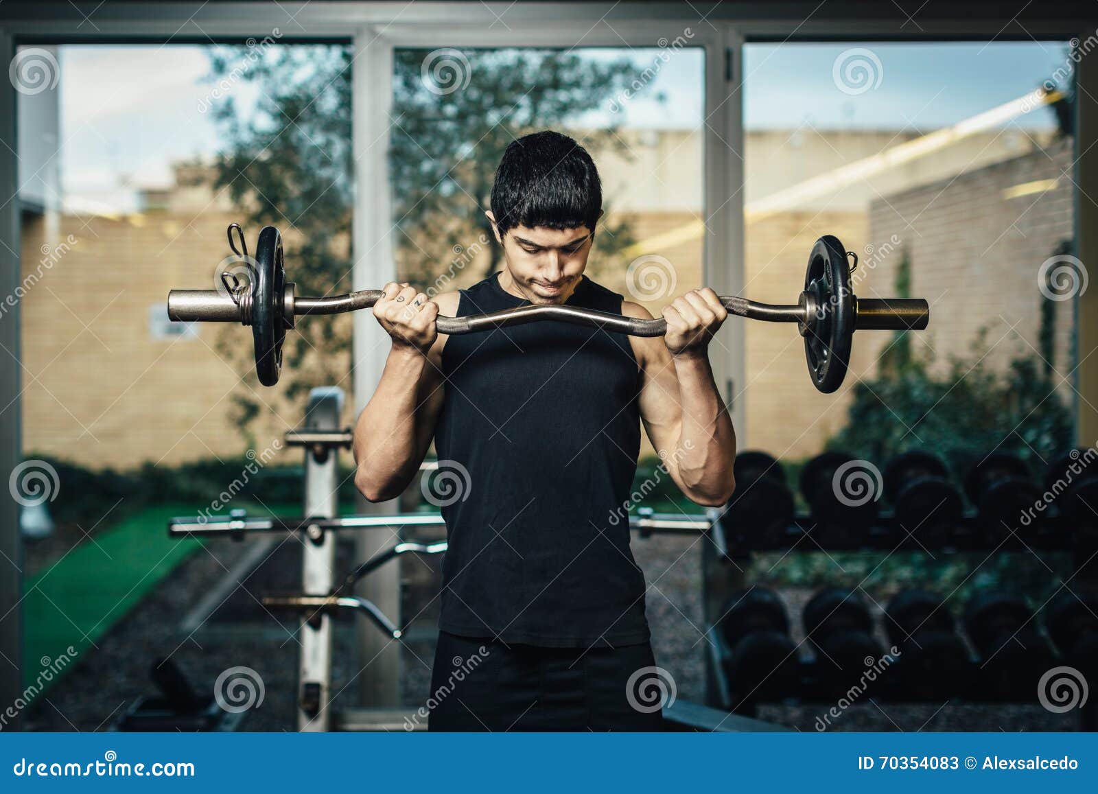 Man doing exercise in gym stock image. Image of exercise - 70354083