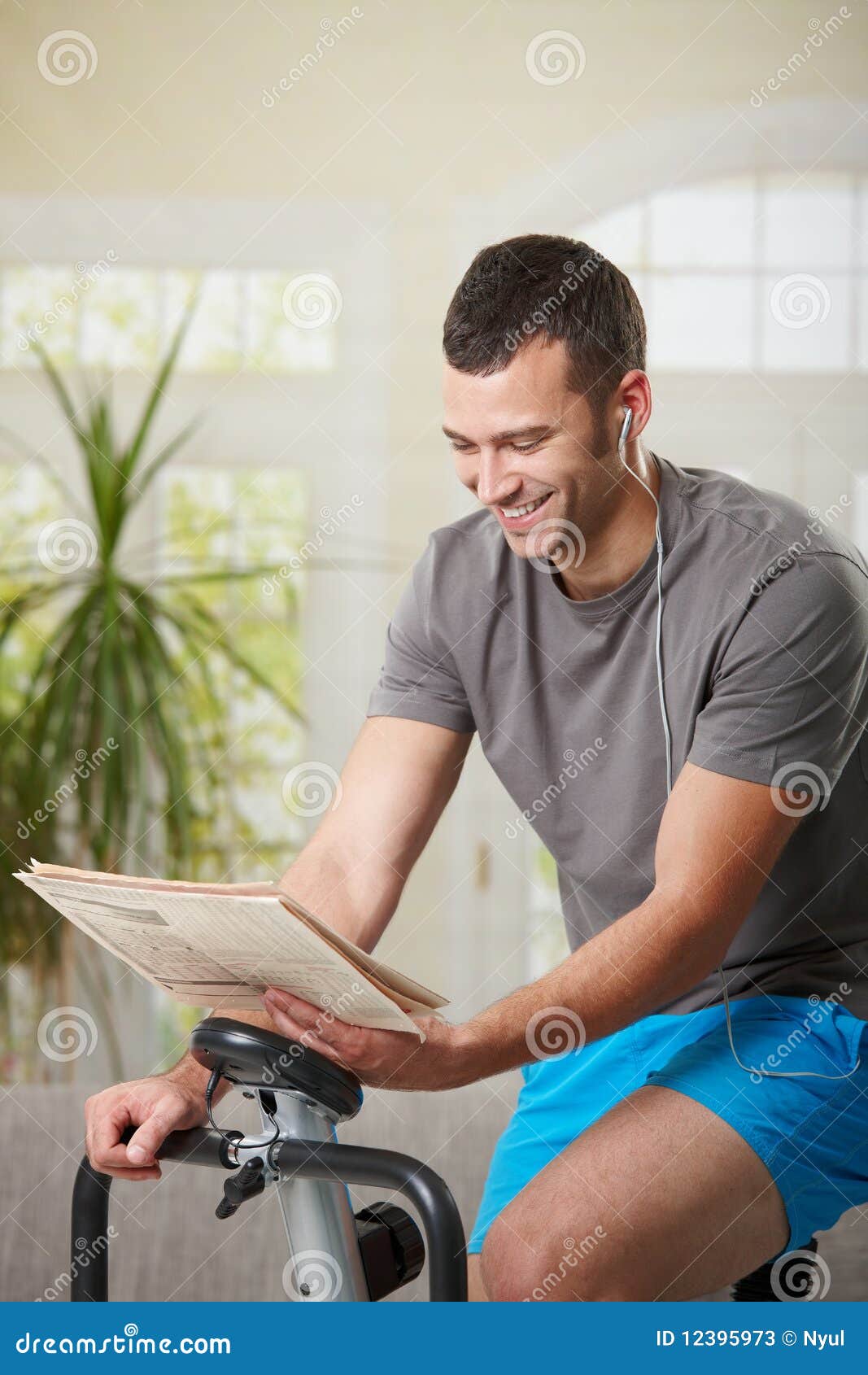 Man doing exercise at home stock image. Image of listening - 12395973