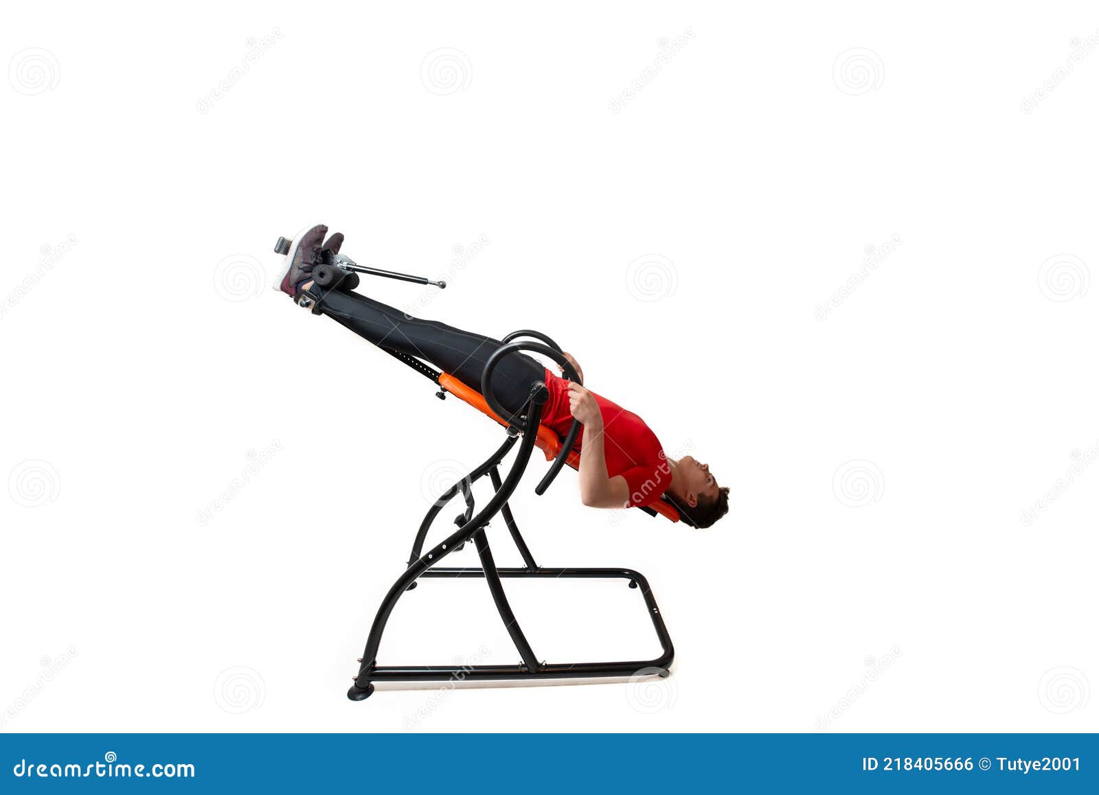 Man Doing Exercise on Inversion Table for His Back Pain, Isolated on ...