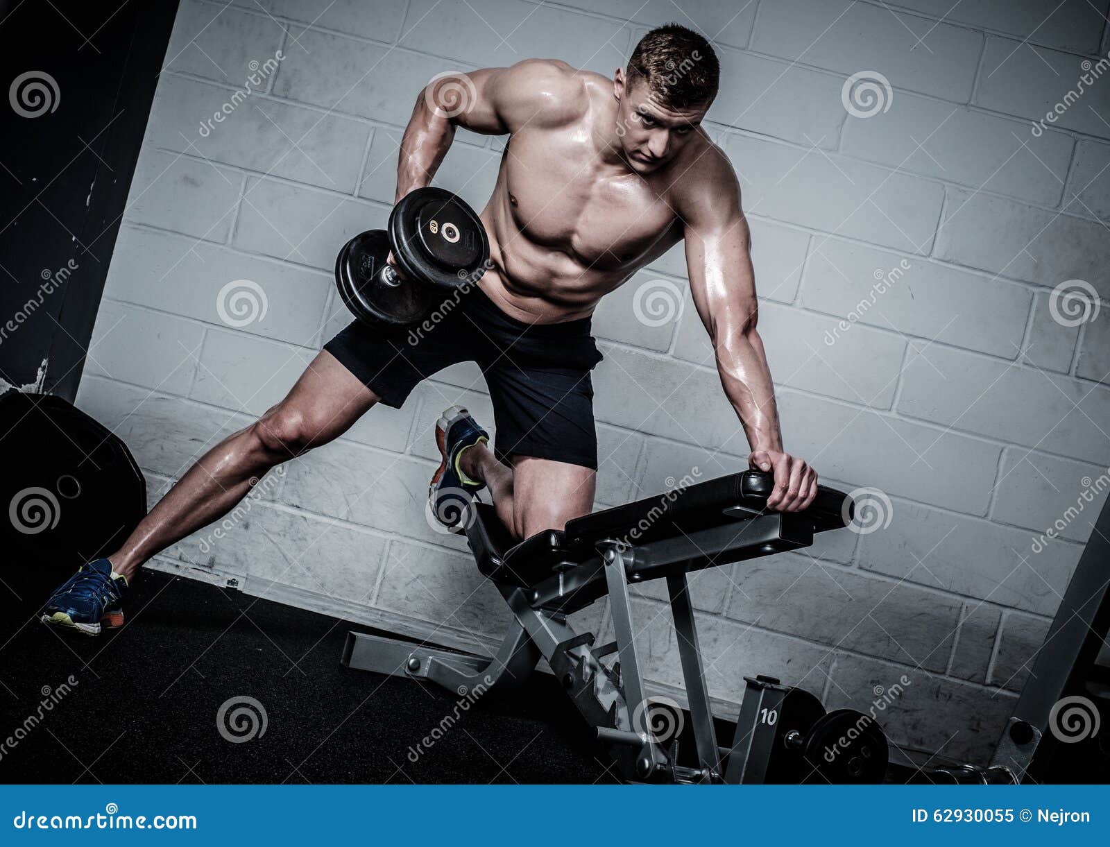 Man Doing Exercises with Dumbbells in the Gym S Studio Stock Image ...