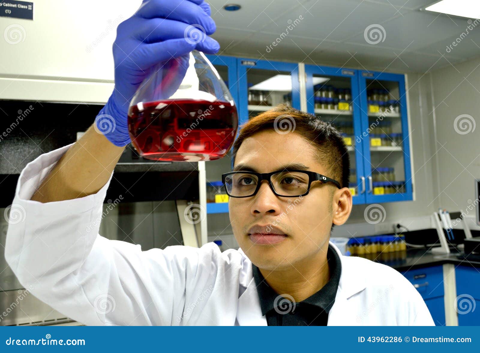 Man Doing an Experiment Holding a Flask Stock Photo - Image of reagent ...