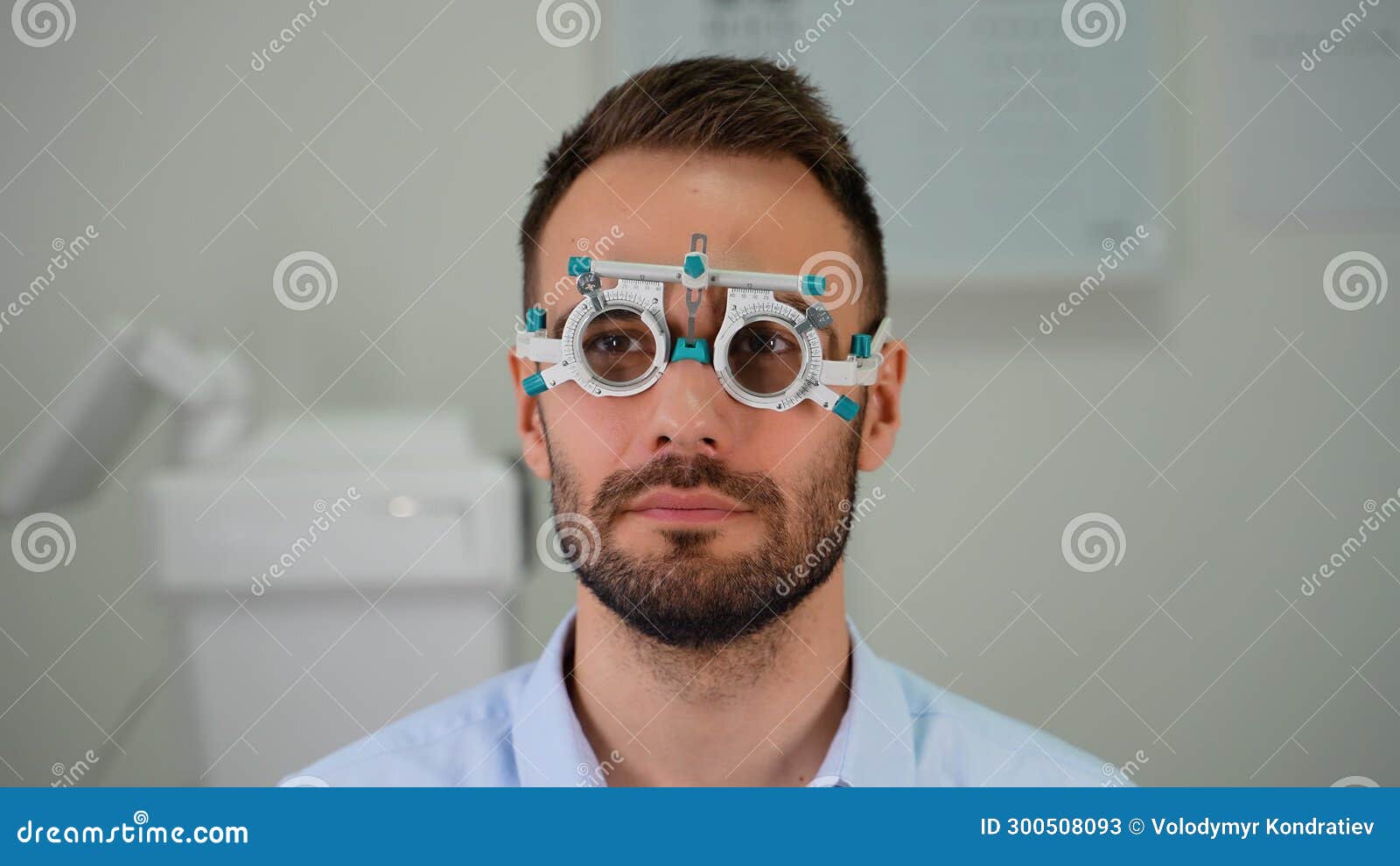 A Man Doing Eyesight Measurement with Trial Frame and Visual Test Chart ...