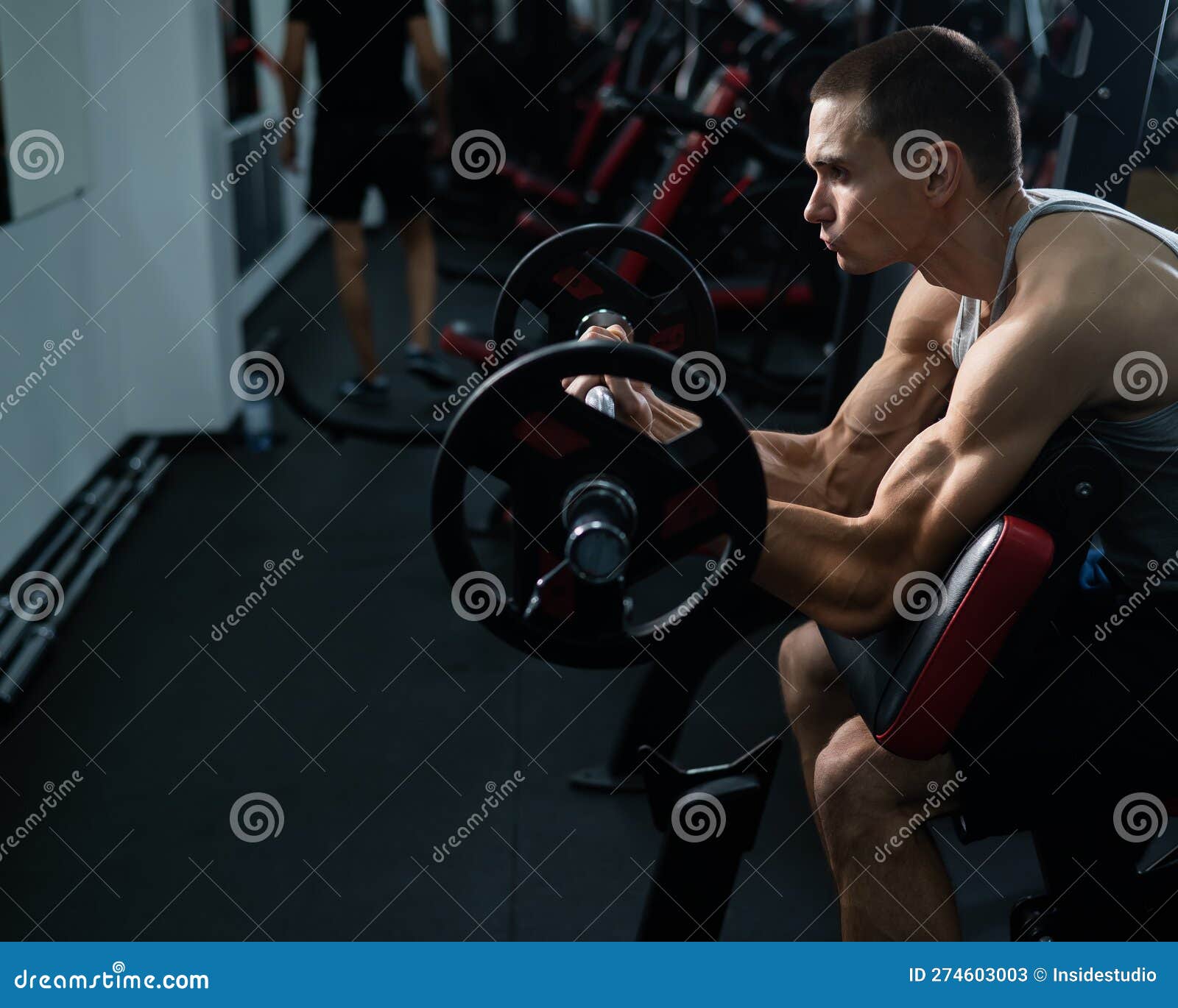 Man Doing EZ Barbell Bicep Exercises on Scott Bench. Stock Image ...