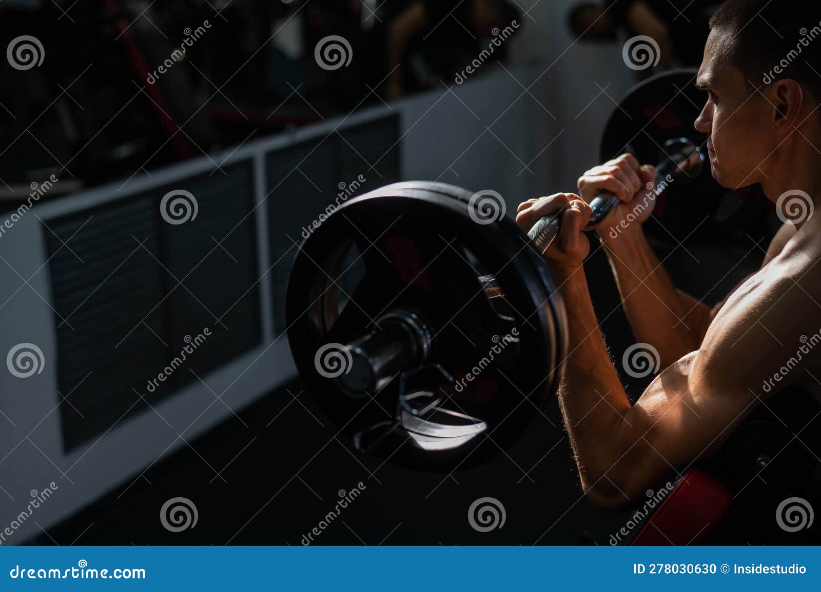 Man Doing EZ Barbell Bicep Exercises on Scott Bench. Stock Photo ...