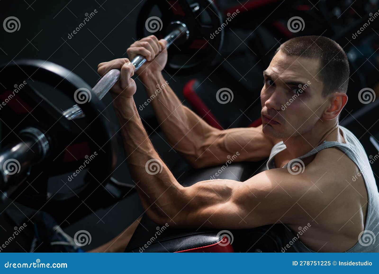 Man Doing EZ Barbell Bicep Exercises on Scott Bench. Stock Image ...