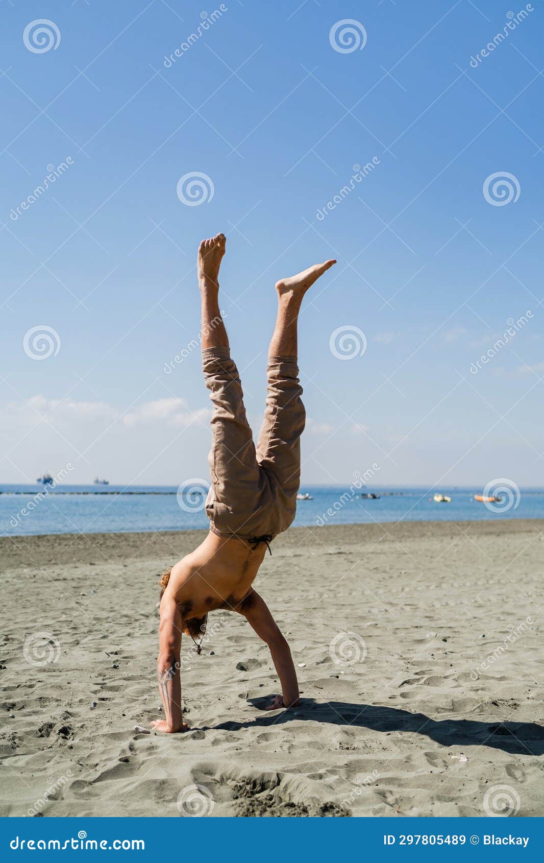 Man Doing Handstand for Strength and Balance on Sandy Beach Stock Image ...