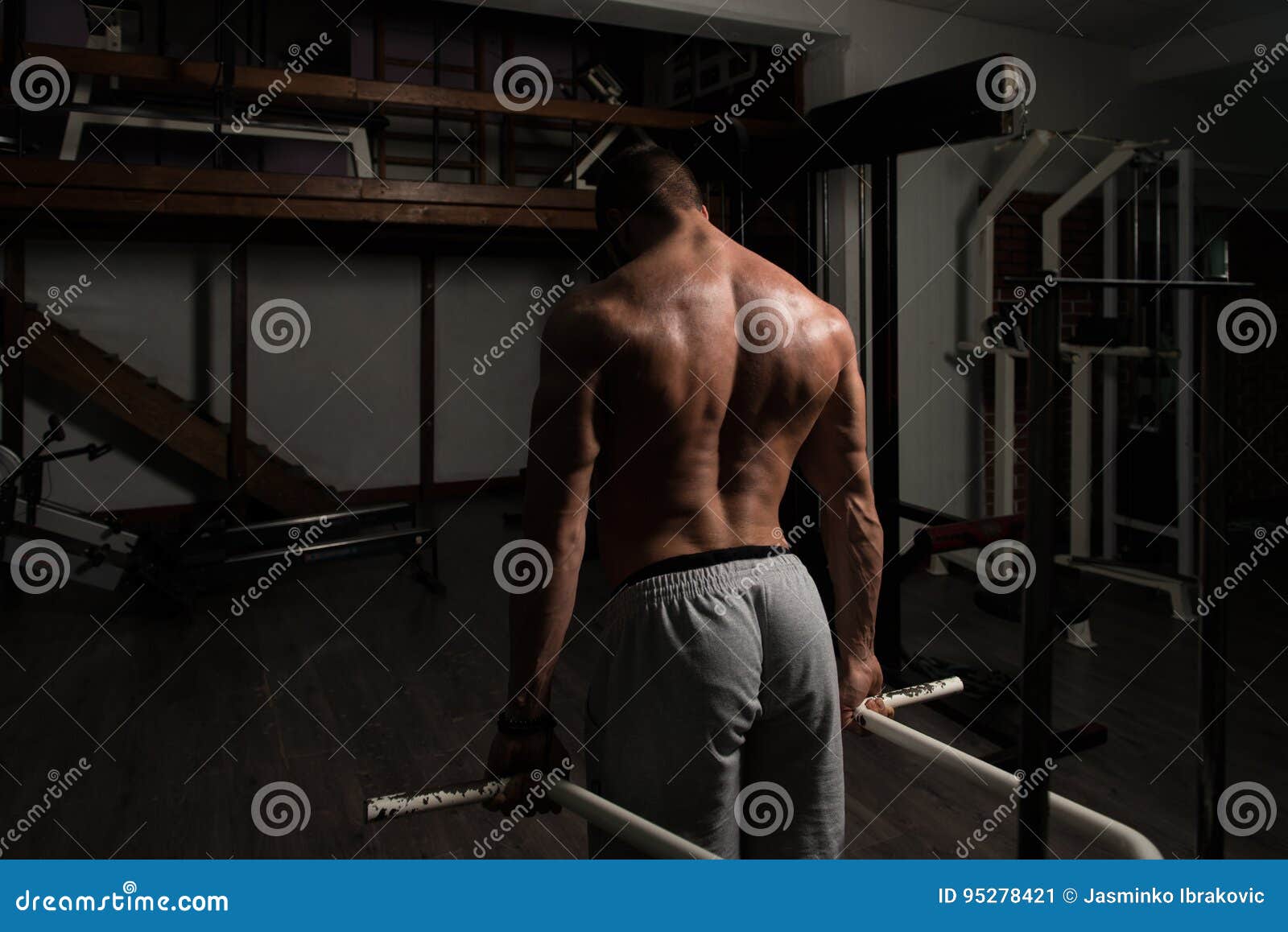 Man Doing Heavy Weight Exercise for Trapezius Stock Image - Image of ...