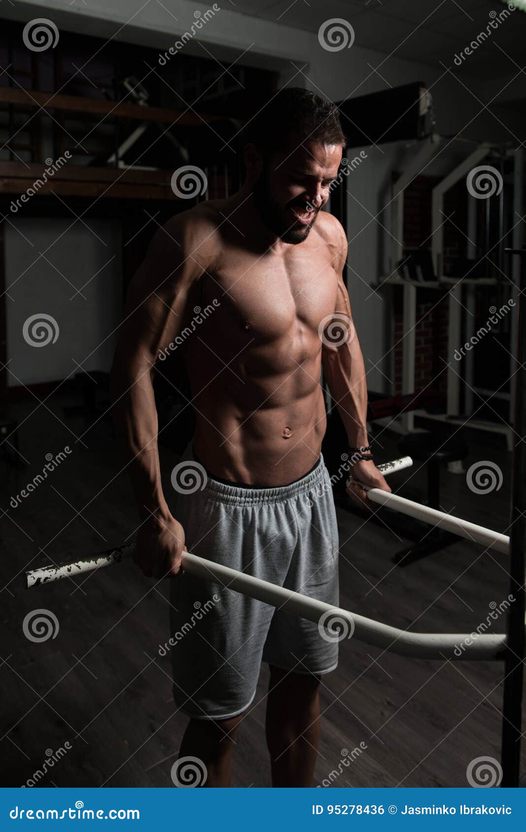 Man Doing Heavy Weight Exercise for Trapezius Stock Photo - Image of ...