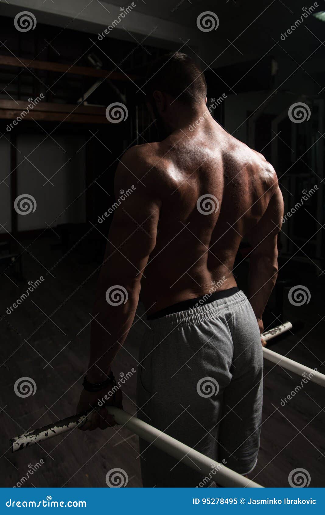 Man Doing Heavy Weight Exercise for Trapezius Stock Image - Image of ...