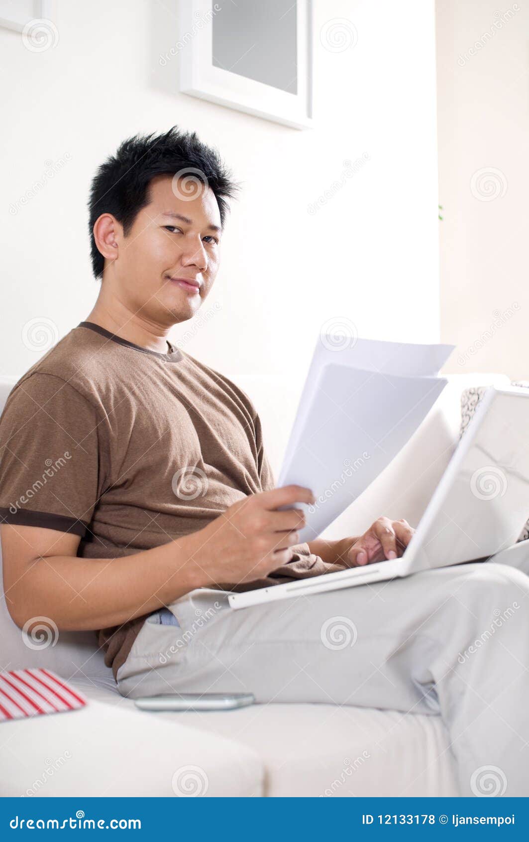 Man doing homework stock photo. Image of couch, sofa - 12133178