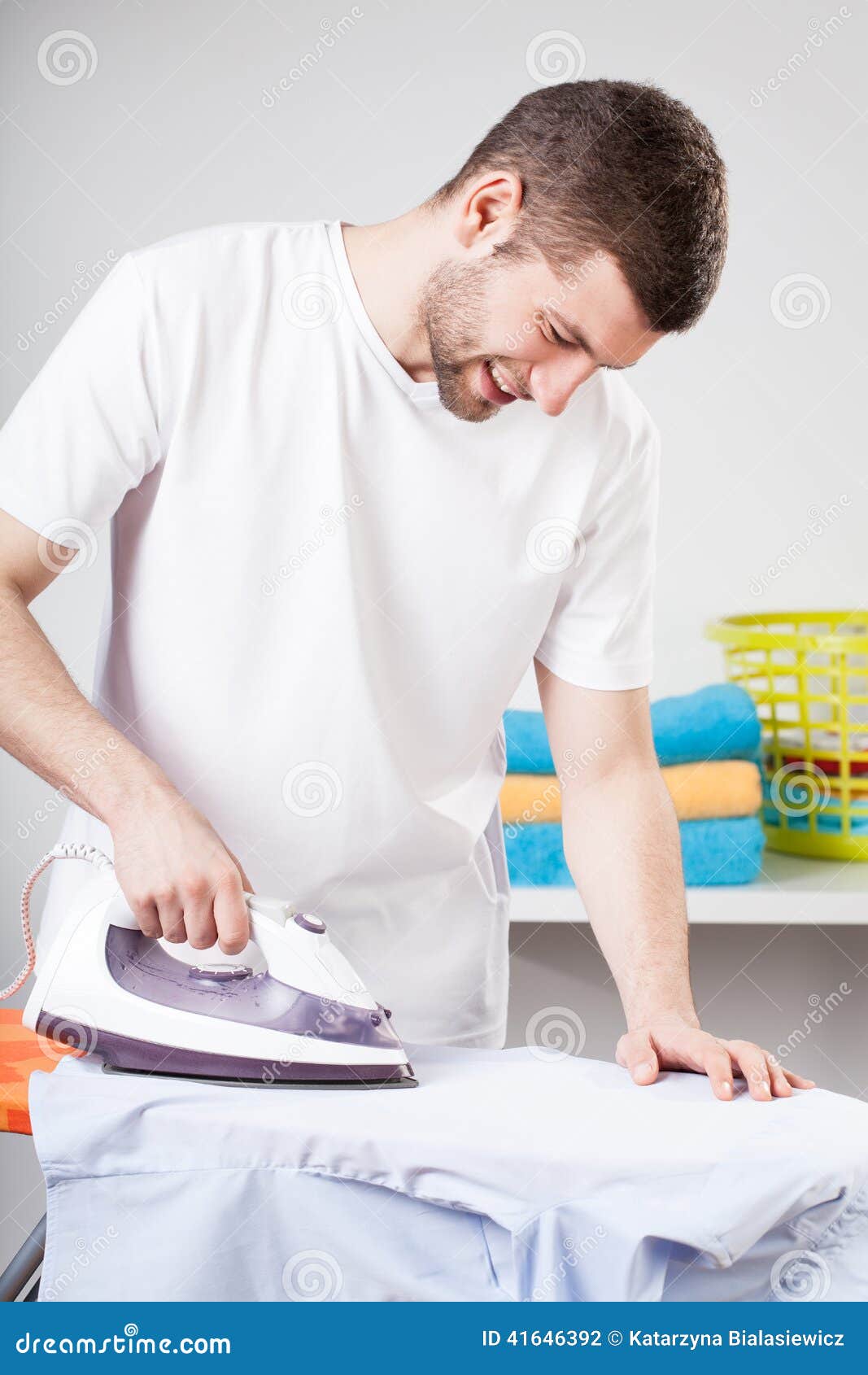 Man doing household chores stock photo. Image of ironing - 41646392
