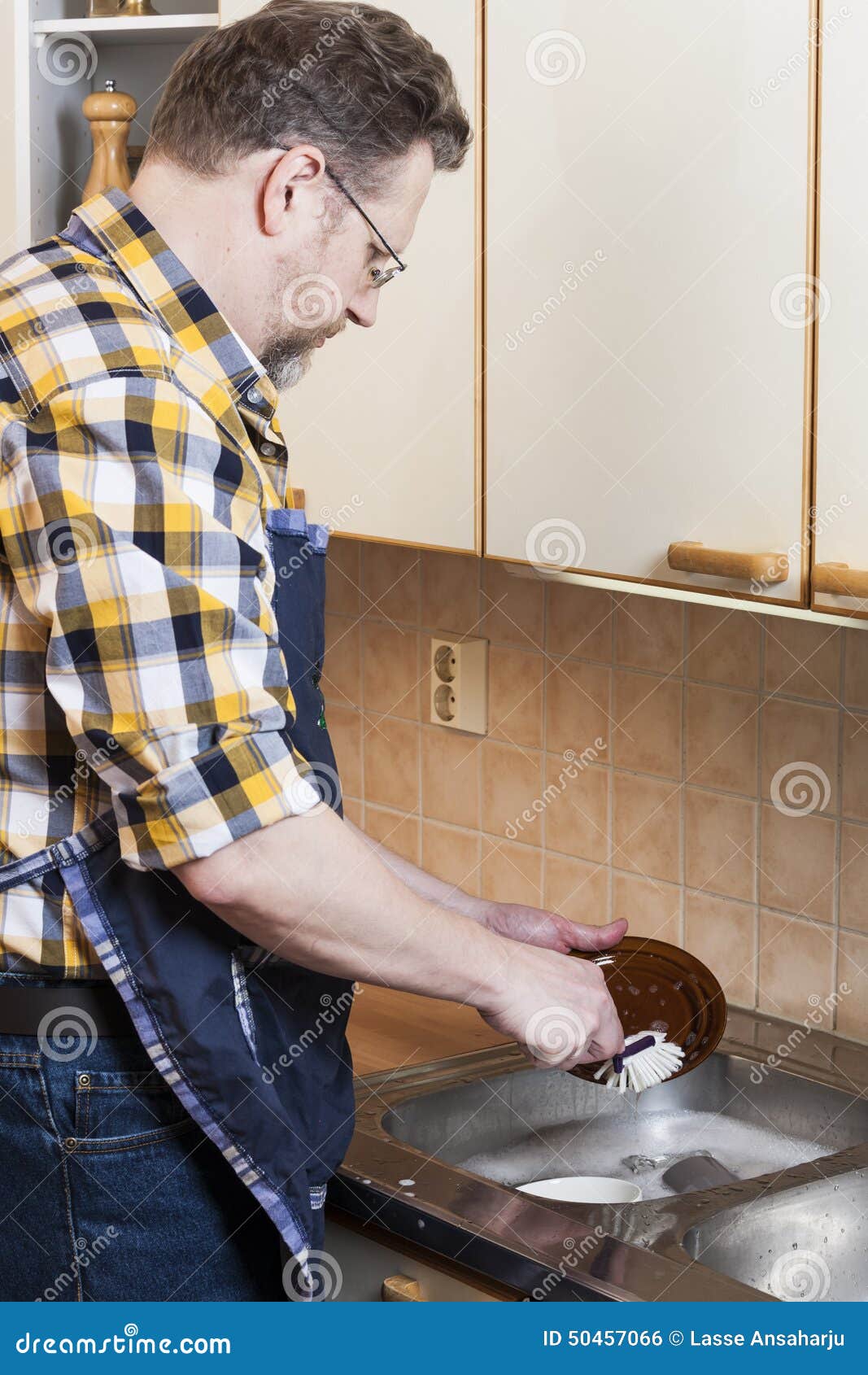 Man doing household chores stock photo. Image of people - 50457066