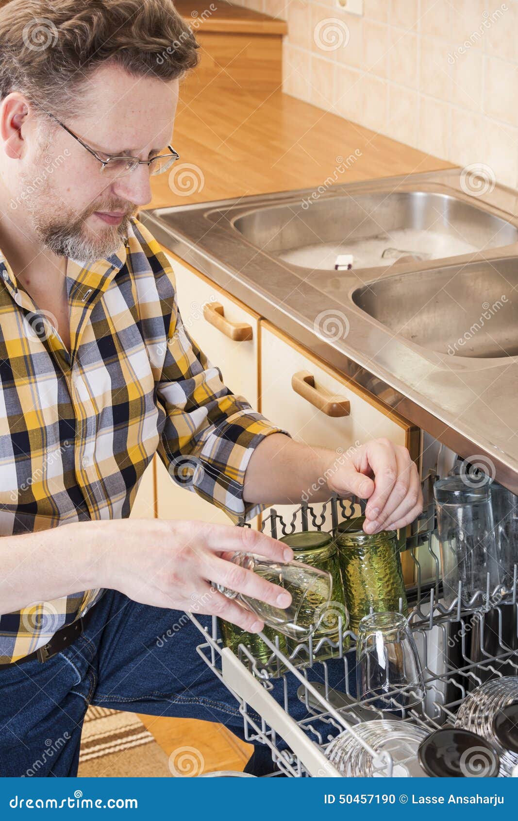 Man doing household chores stock photo. Image of domestic - 50457190