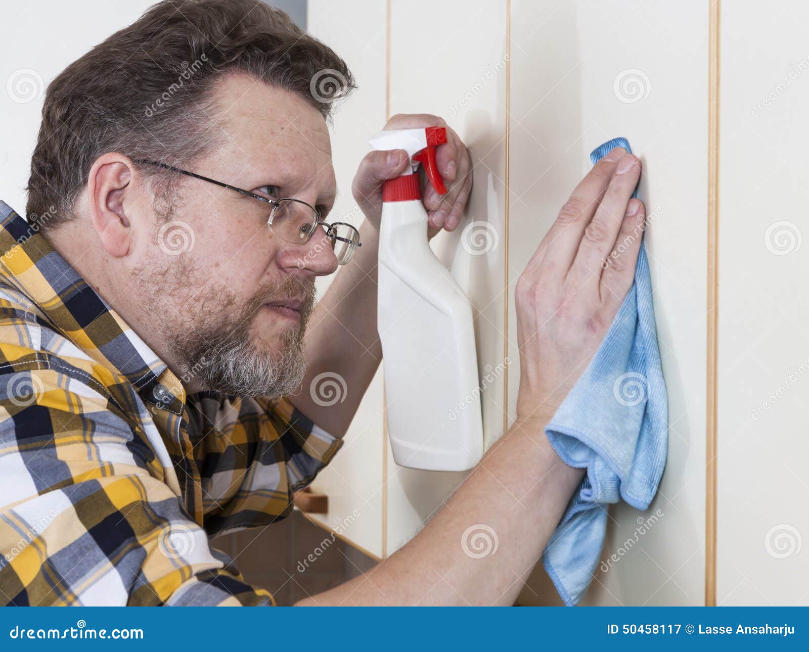 Man doing household chores stock image. Image of home - 50458117