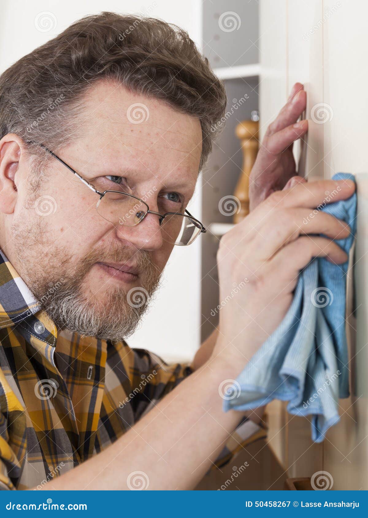 Man doing household chores stock image. Image of spectacles - 50458267