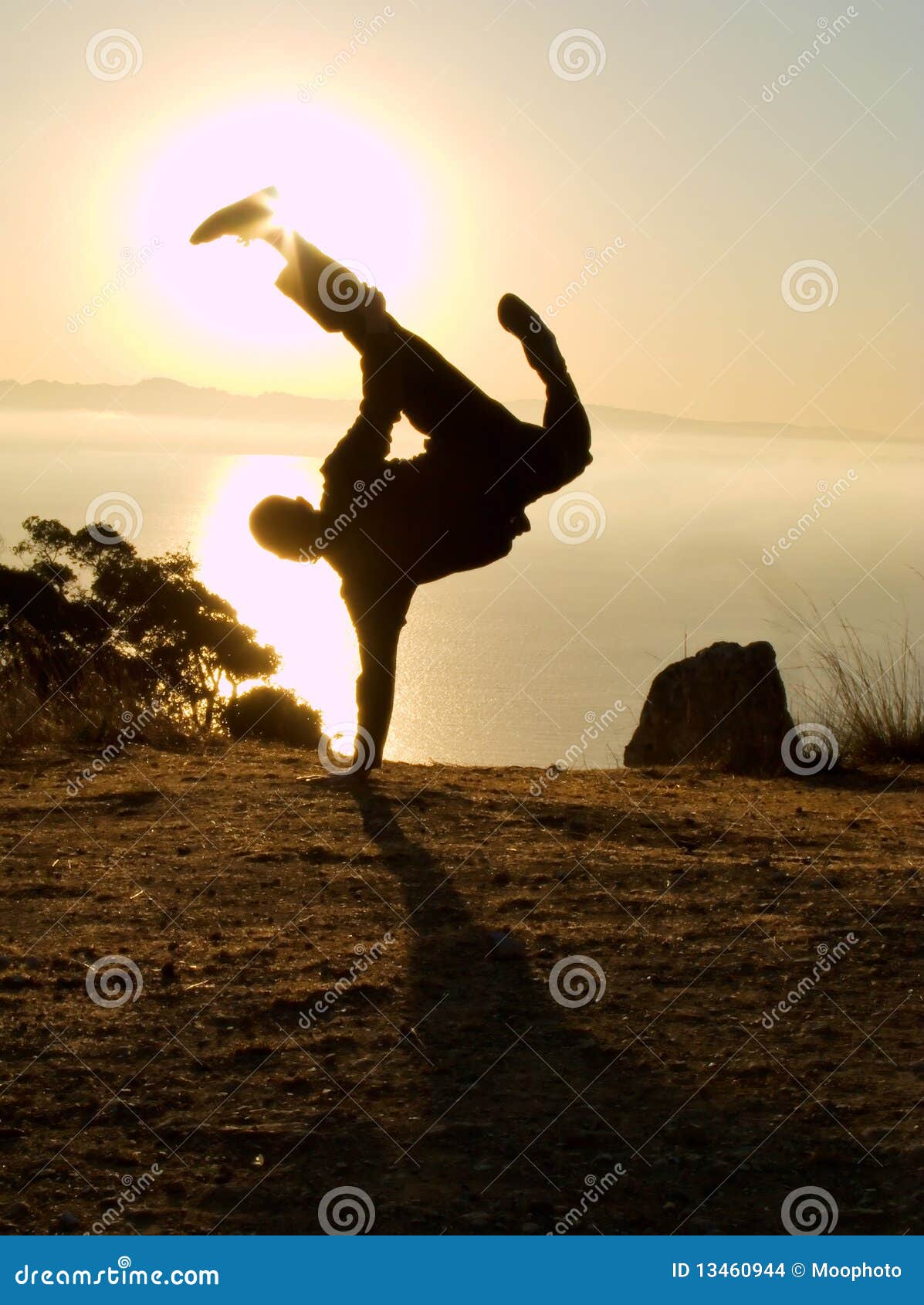 Man Doing Impressive One Hand Handstand at Dawn Stock Photo - Image of ...