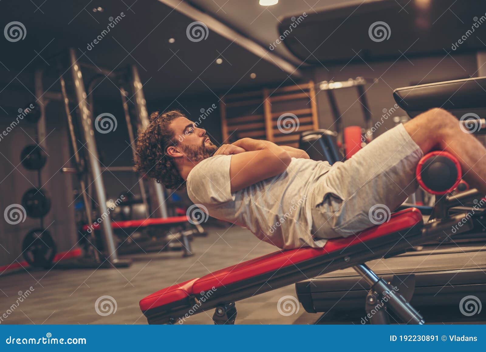 Man Doing Incline Bench Sit Ups Stock Image - Image of leisure, athlete ...