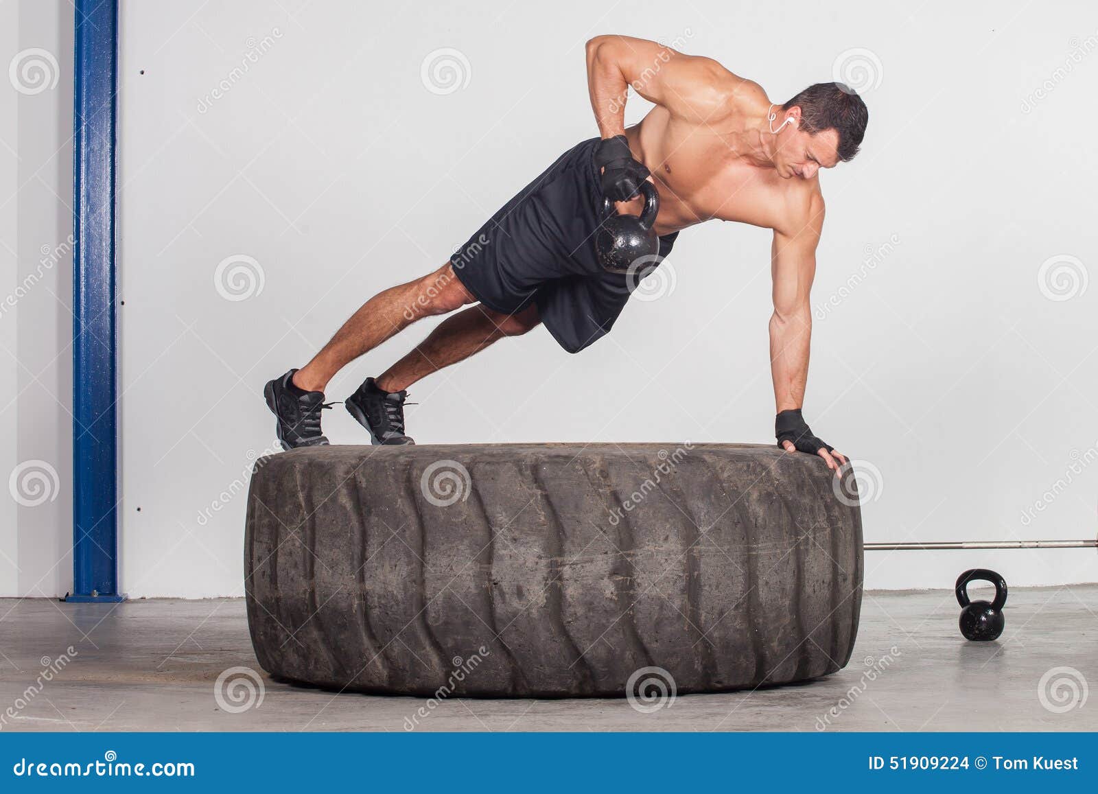 Man Doing Kettlebell Training on a Tire Crossfit Stock Photo - Image of ...