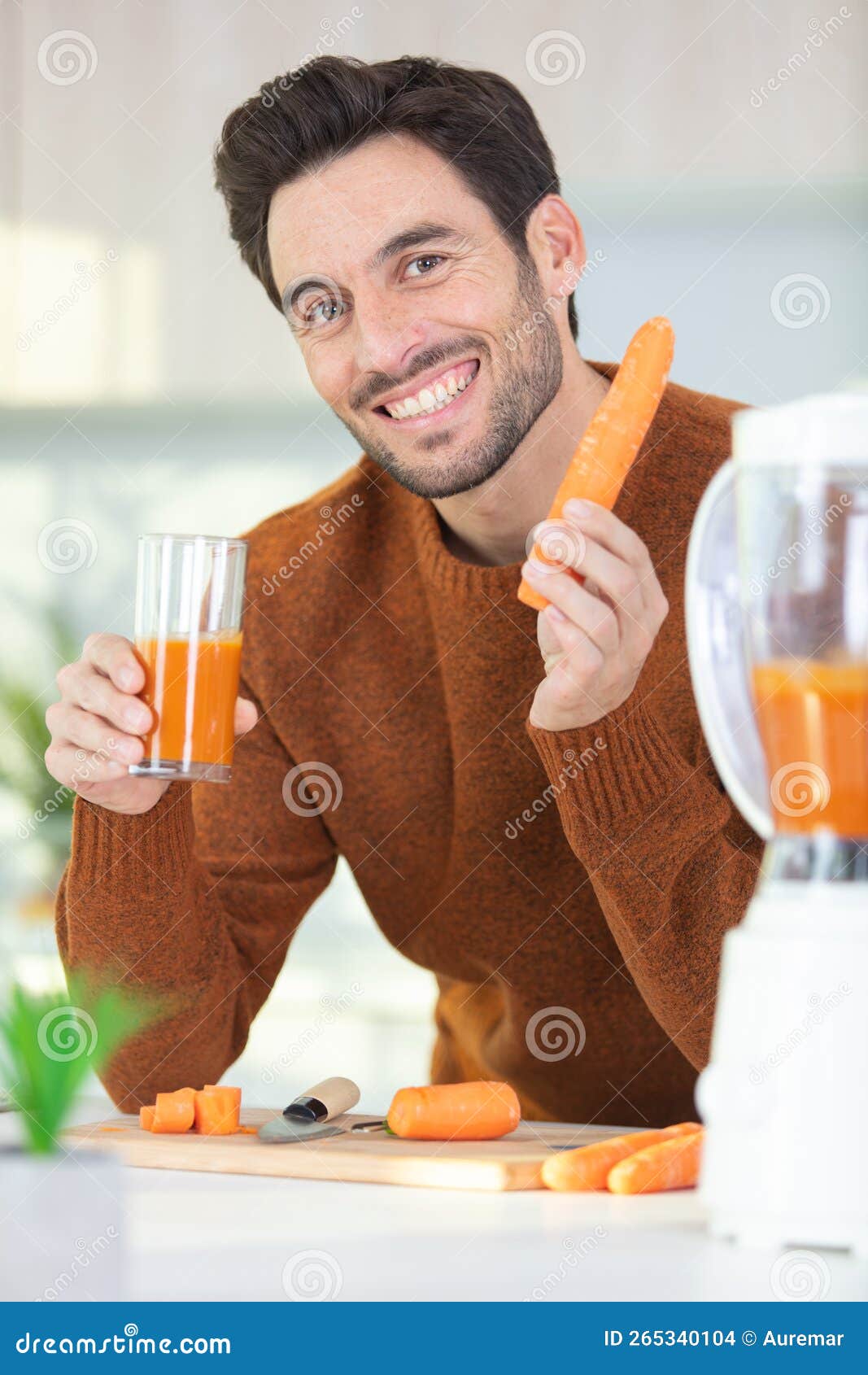Man Doing in Kitchen Juice with Carrots Stock Photo - Image of juicing ...