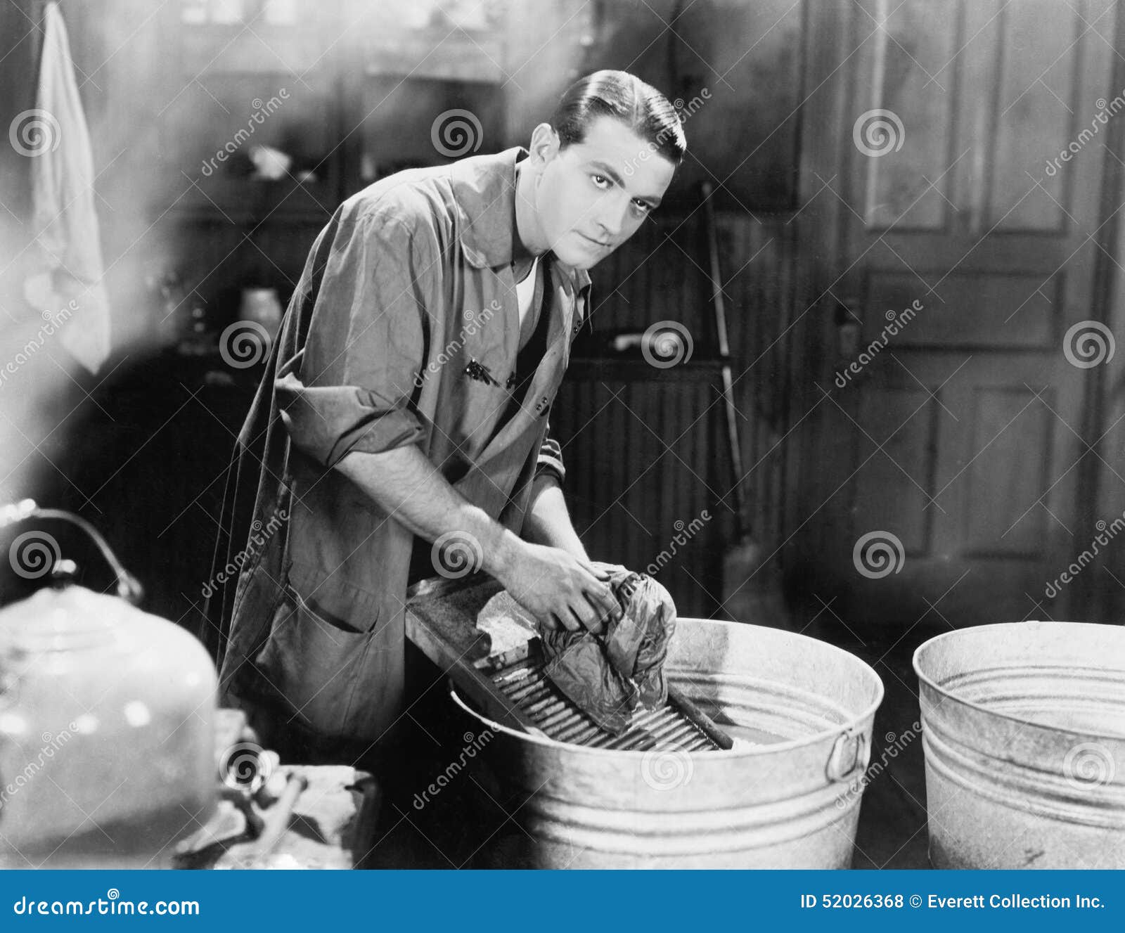 Man doing laundry stock photo. Image of indoor, bucket - 52026368
