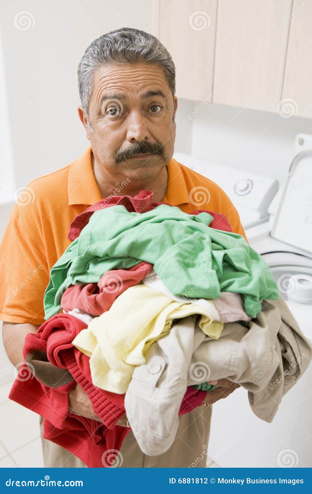 Man Doing Laundry stock photo. Image of looking, laundry - 6881812