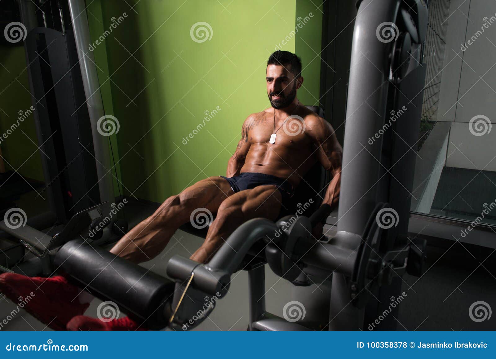 Strong Man Doing Legs Exercise in the Gym Stock Photo - Image of health ...