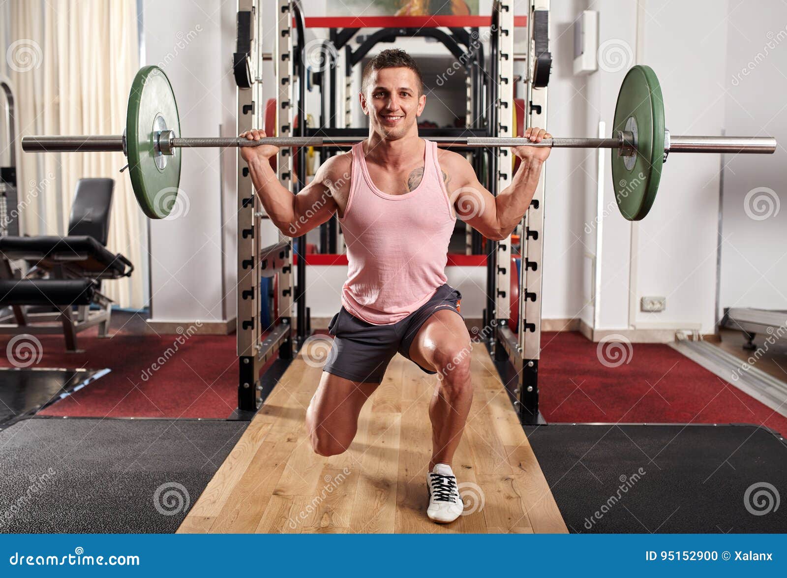 Man Doing Lunges with Barbell Stock Photo - Image of muscular, lifting ...