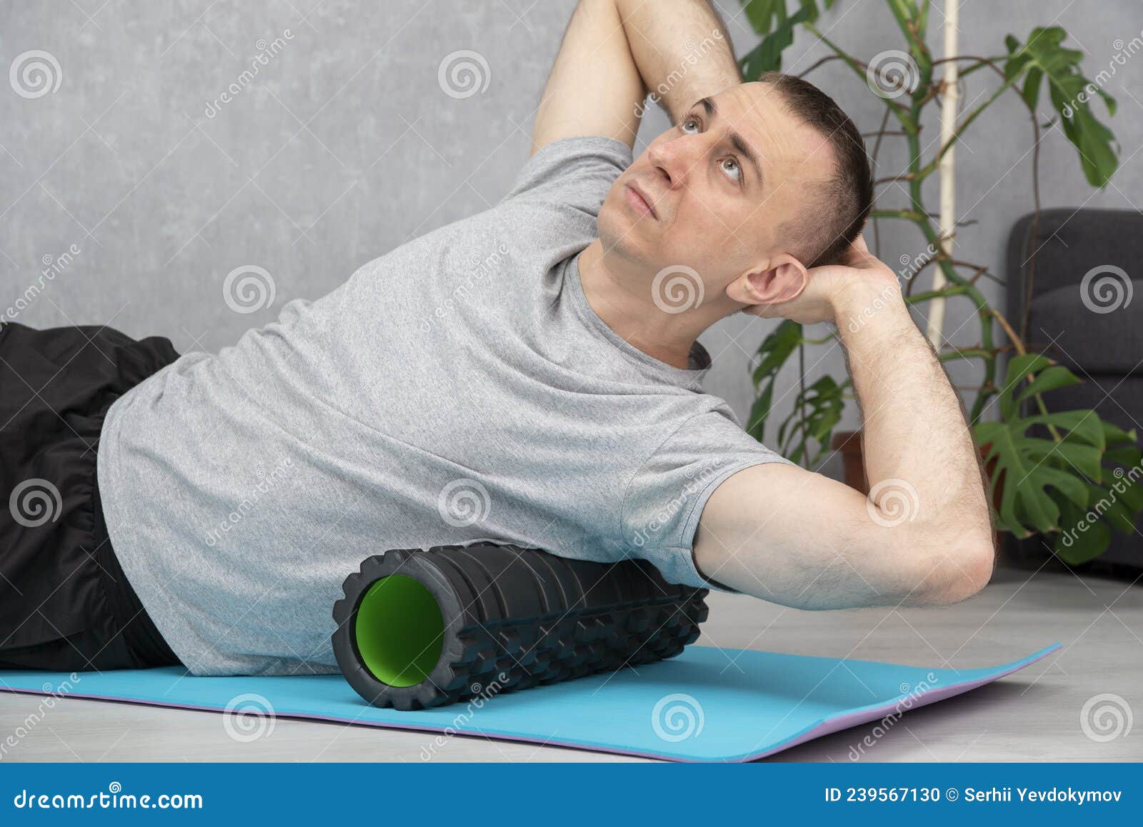 Man Doing Myofascial Release of Hyper-flexible Muscles of Back with ...