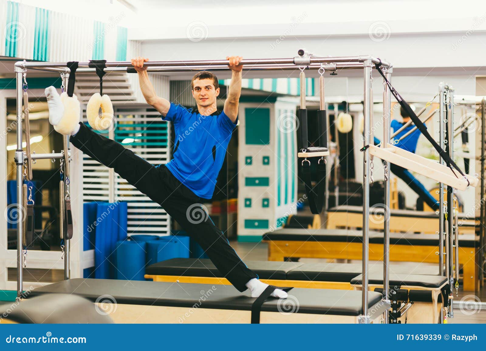 Man Doing Pilates Exercises Stock Image - Image of cadillac, vitality ...
