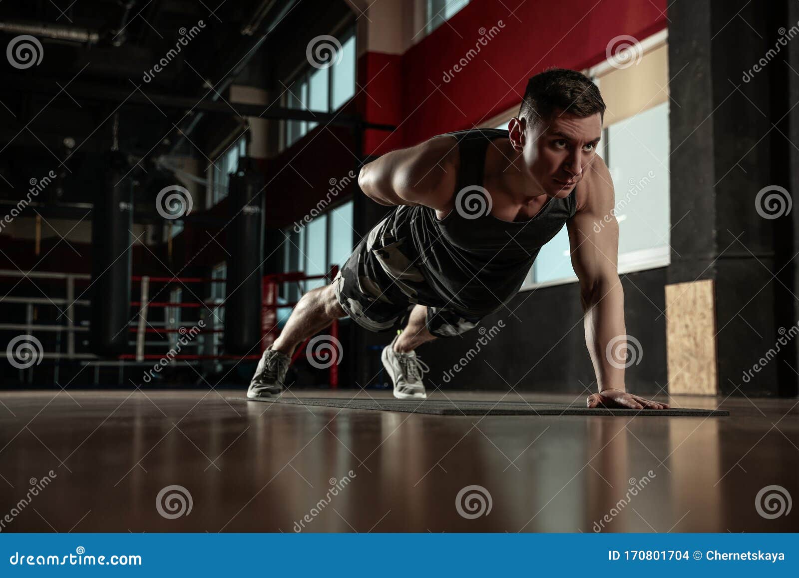 Man Doing Plank Exercise in Gym Stock Photo - Image of hard, energy ...