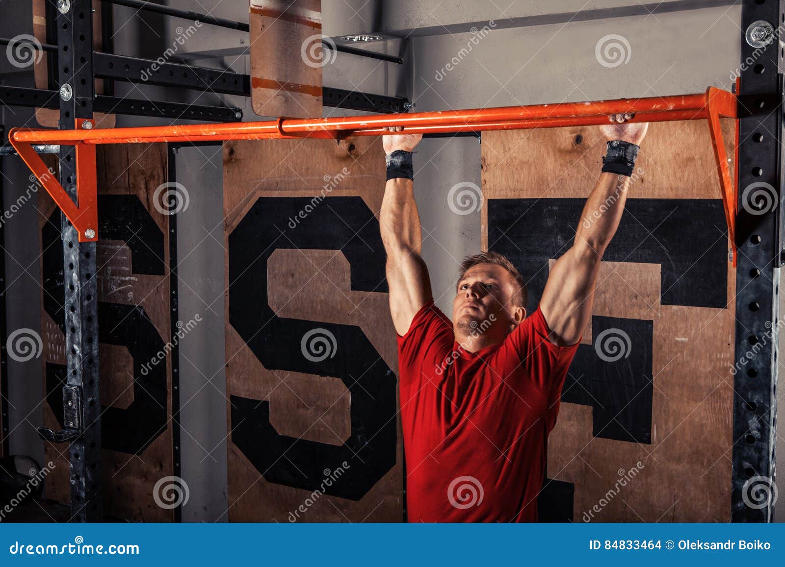 Man doing pull ups stock photo. Image of male, handsome - 84833464