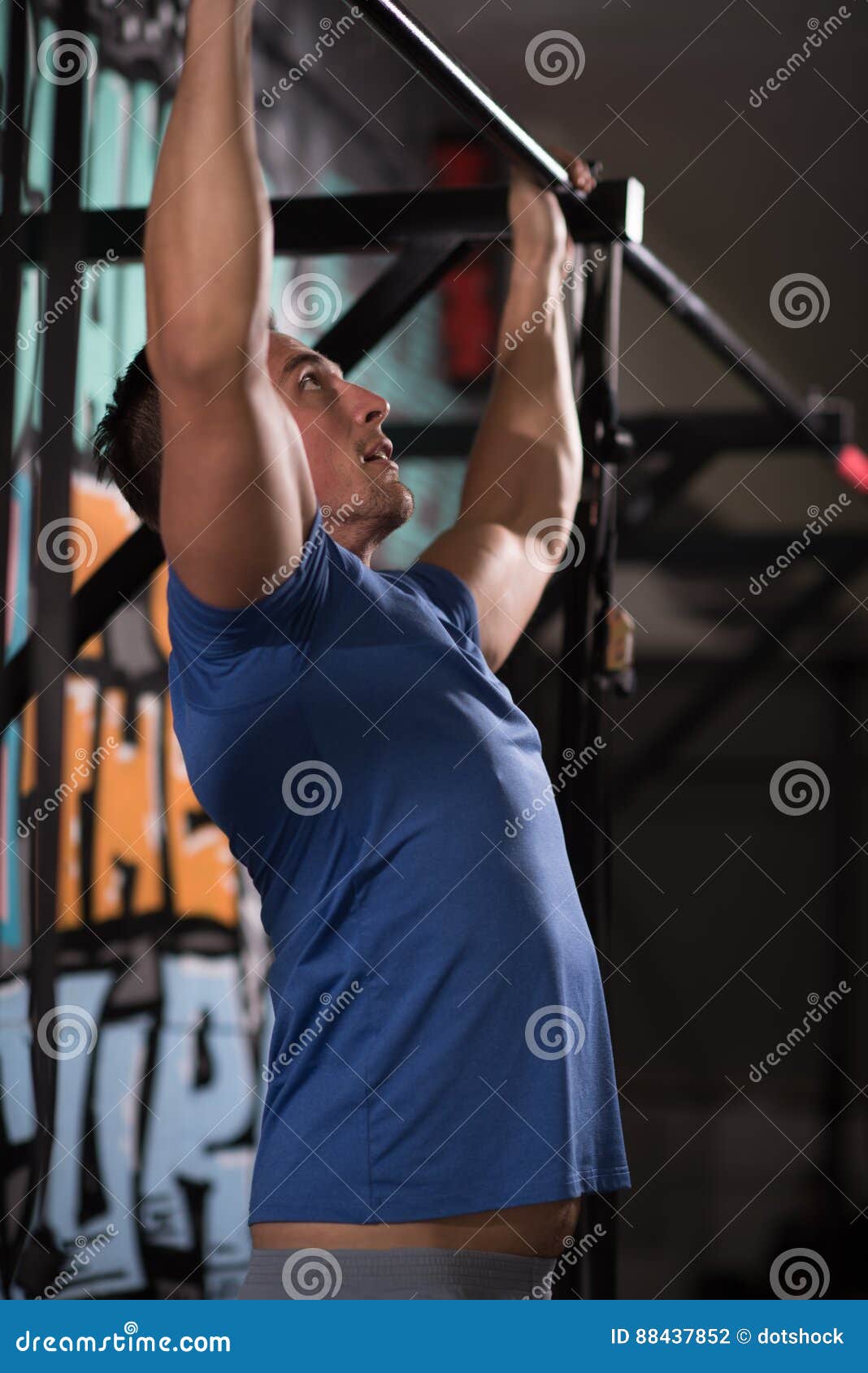 Man doing pull ups stock photo. Image of club, equipment - 88437852