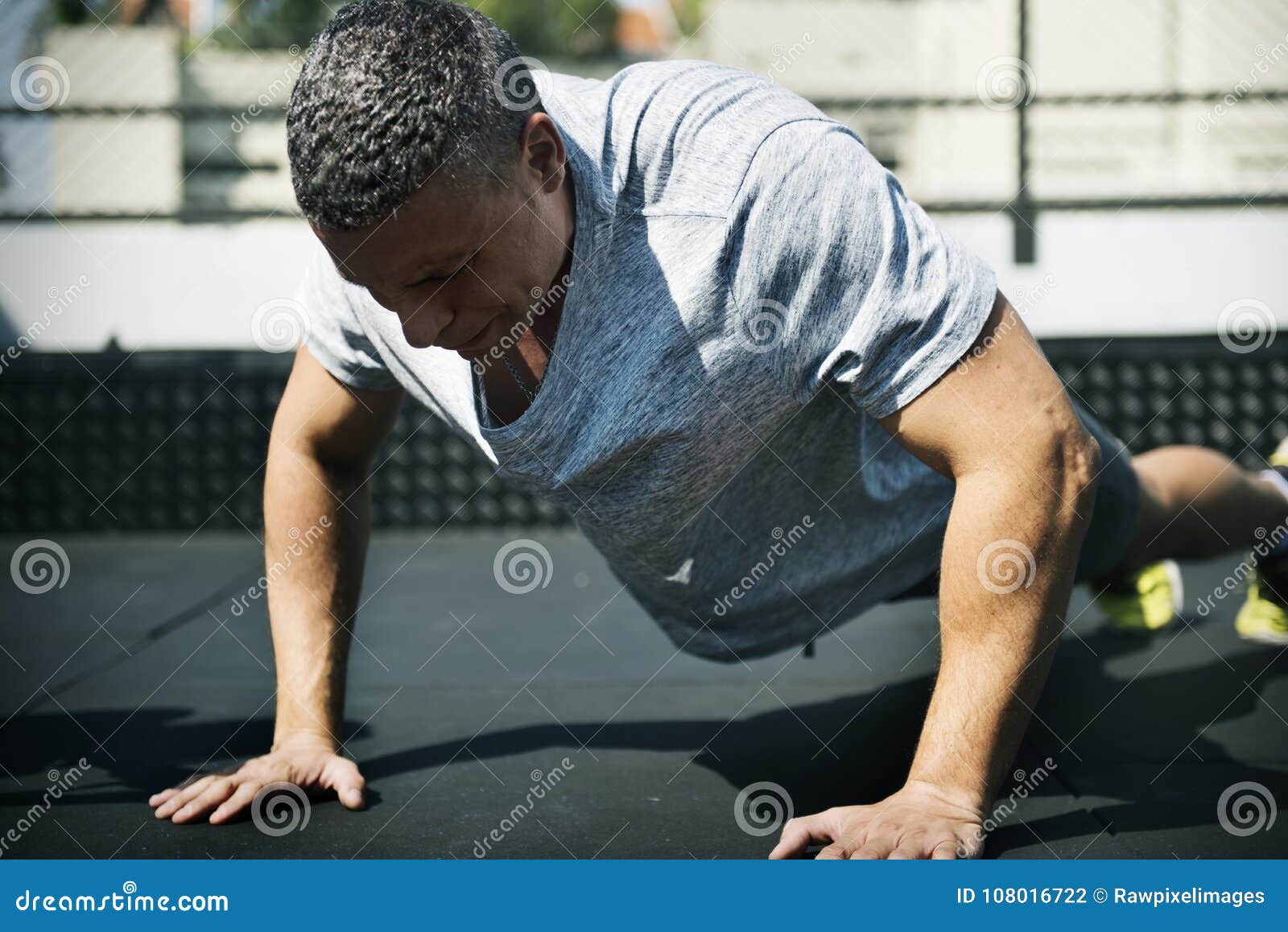 Man doing a push up stock photo. Image of america, europe - 108016722