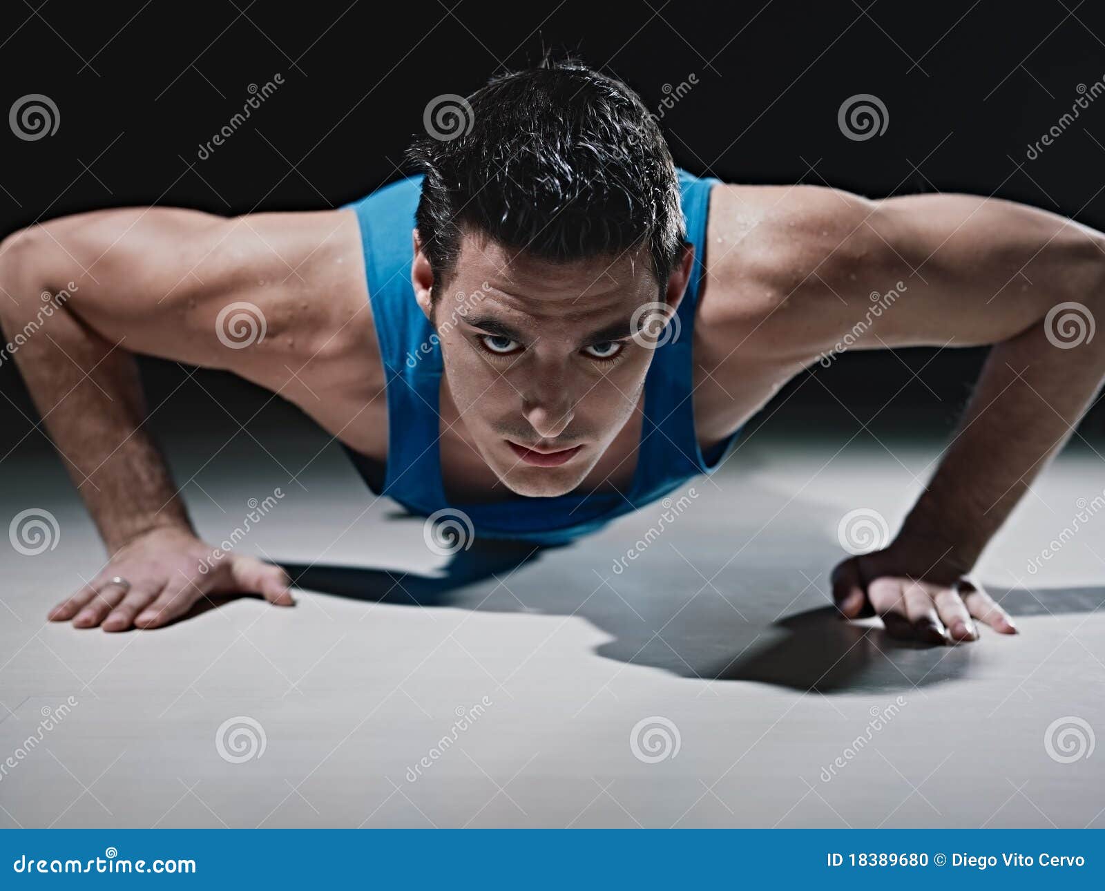Man Doing Push-ups on Black Background Stock Photo - Image of brunette ...