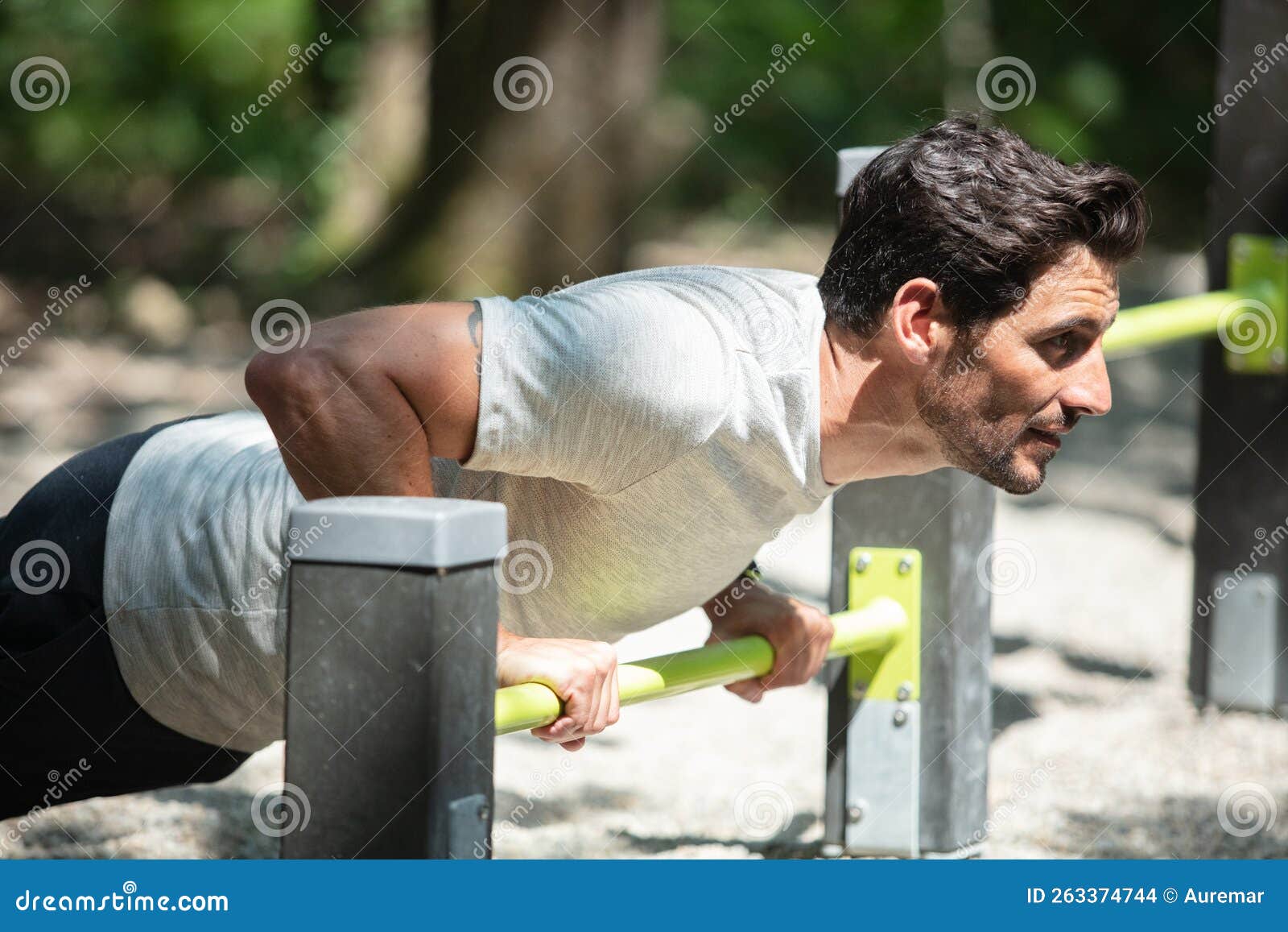 Man Doing Push Ups Exercise at Horizontal Bars Stock Photo - Image of ...