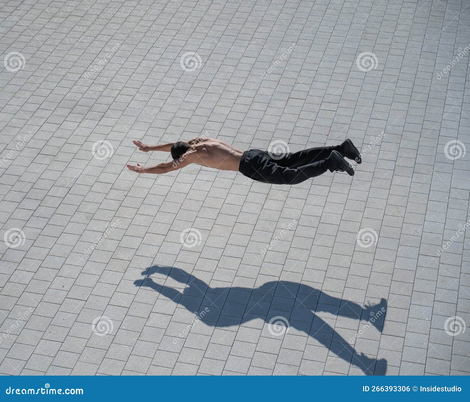 A Man Doing Push-ups with Flying Outdoors. Stock Photo - Image of ...