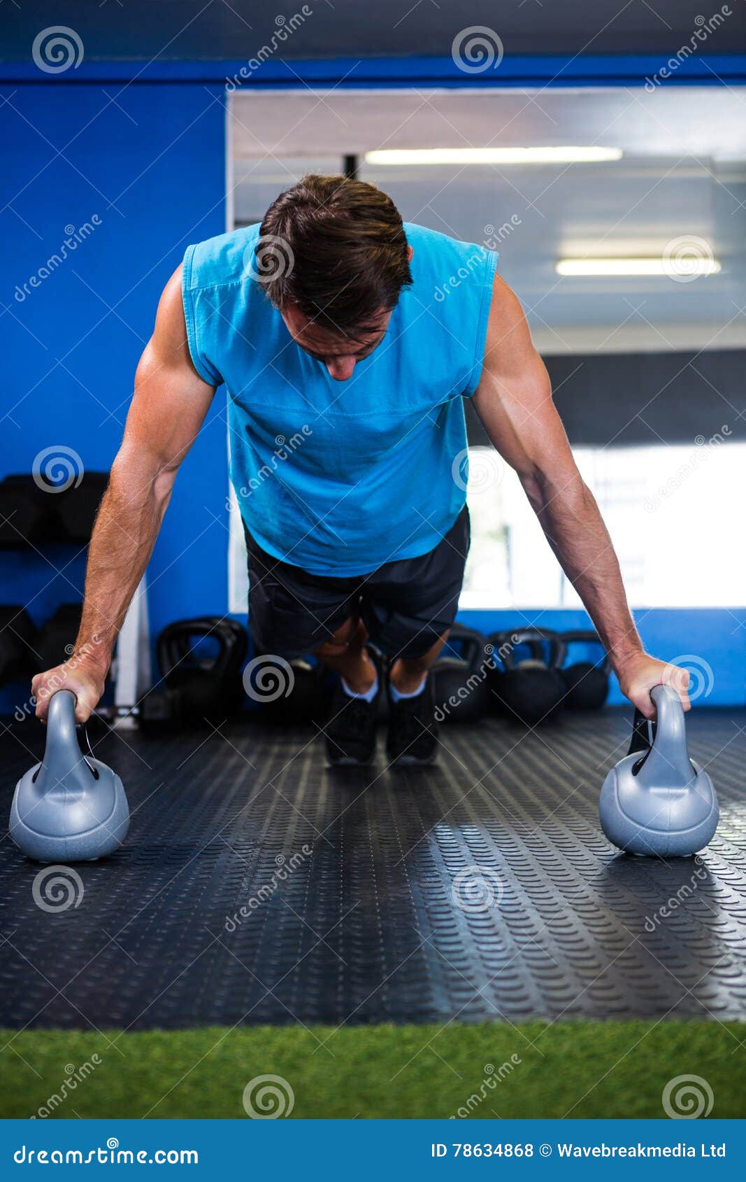 Man Doing Push-ups with Kettlebell Stock Photo - Image of health, front ...