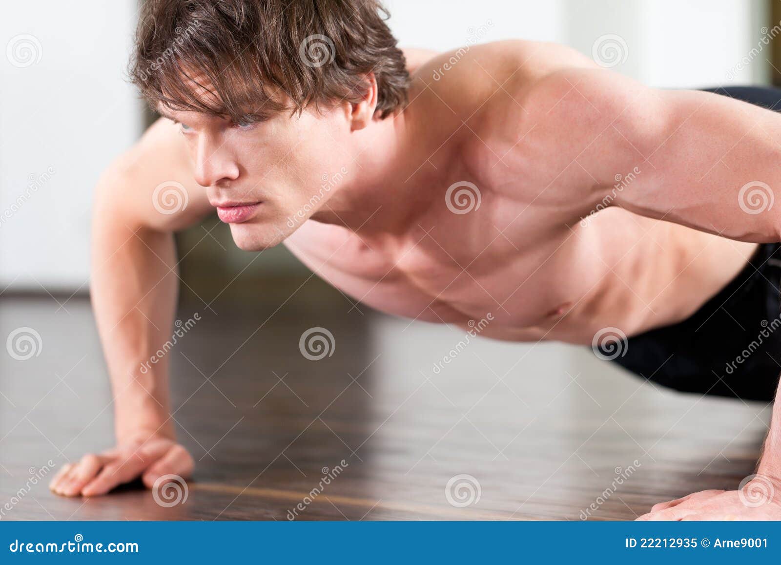 Man doing pushups in gym stock image. Image of people - 22212935