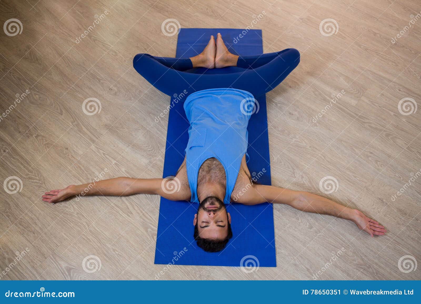 Man Doing Reclining Bound Angle Pose on Exercise Mat Stock Image ...