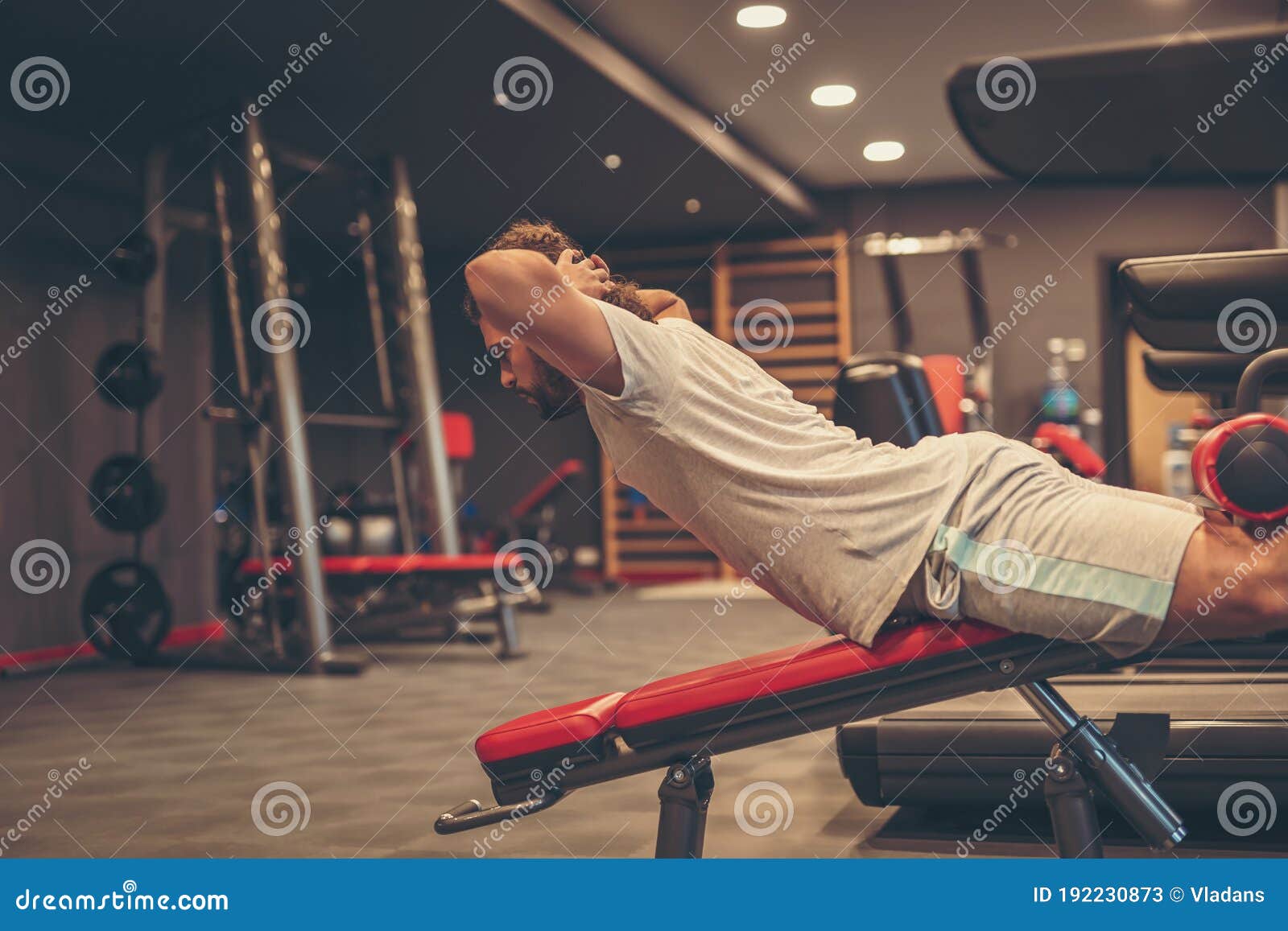 Man Doing Reverse Bench Sit Ups Stock Image - Image of handsome ...