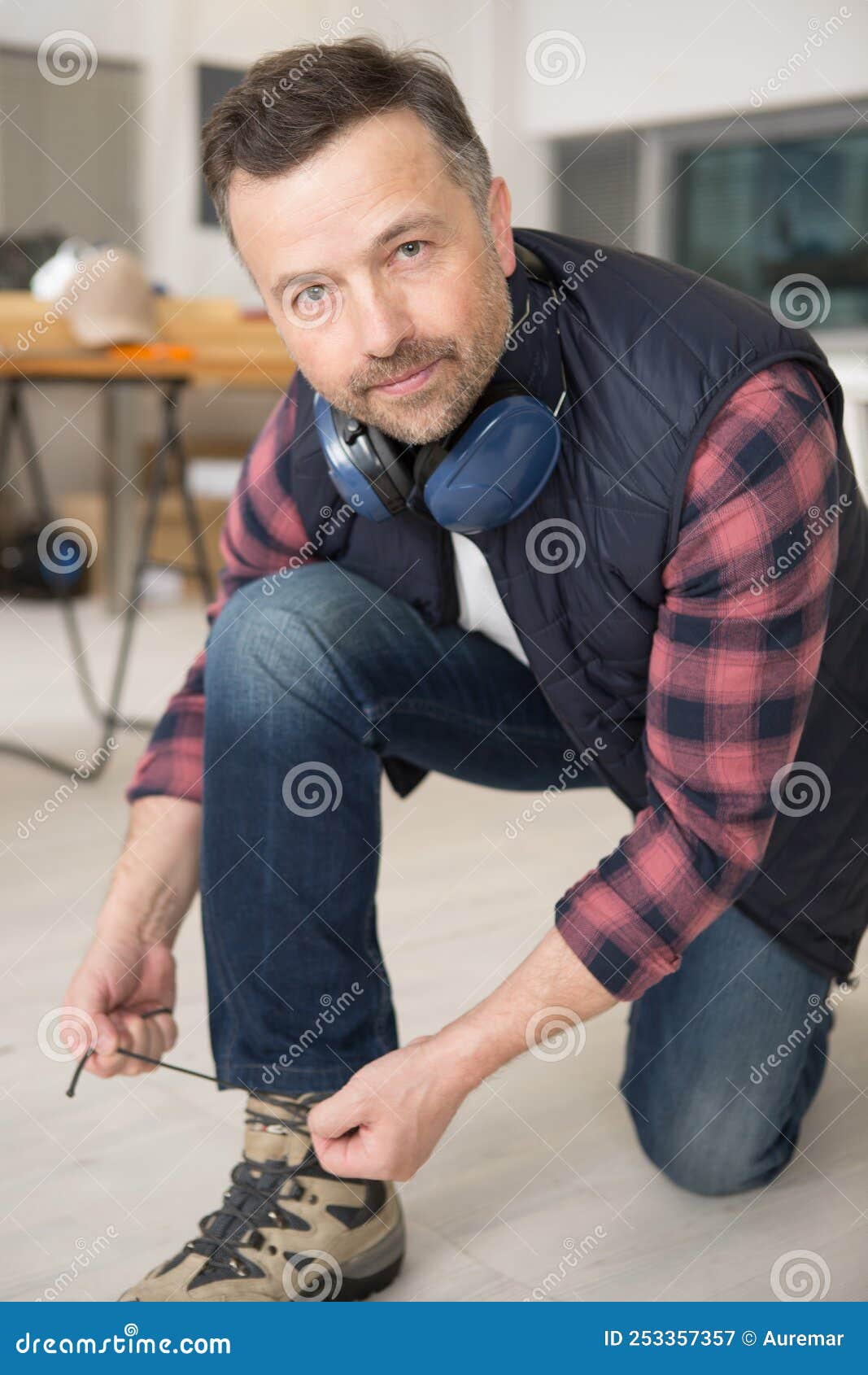 Man doing shoe laces stock image. Image of durable, grungy - 253357357