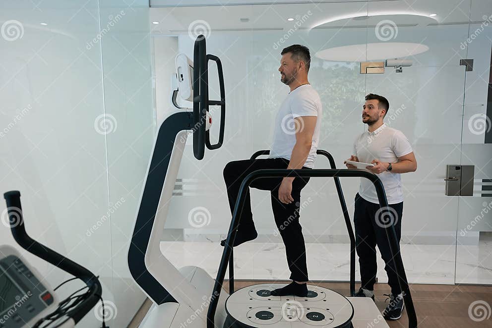 Man Doing Single-leg Balance Exercise with Rehabilitation Equipment ... Man Doing Single-leg Balance Exercise with Rehabilitation Equipment ...