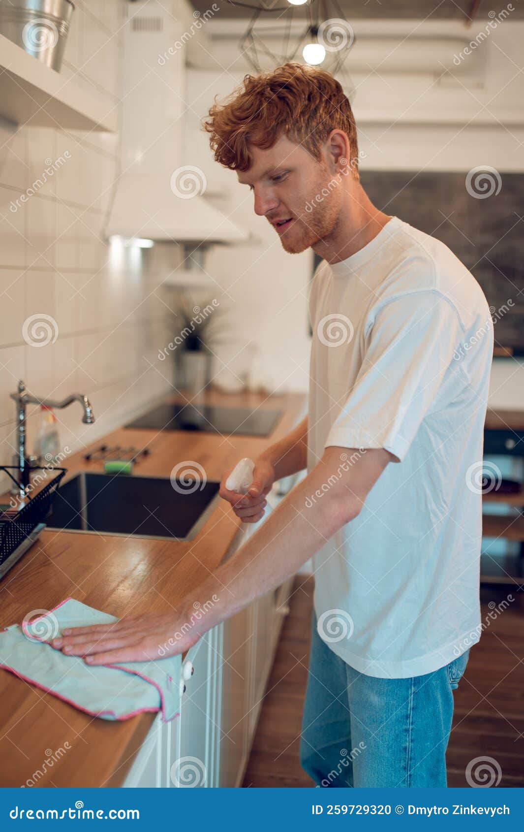 Man Doing Some Housework and Cleaning Some Surfaces Stock Photo - Image ...