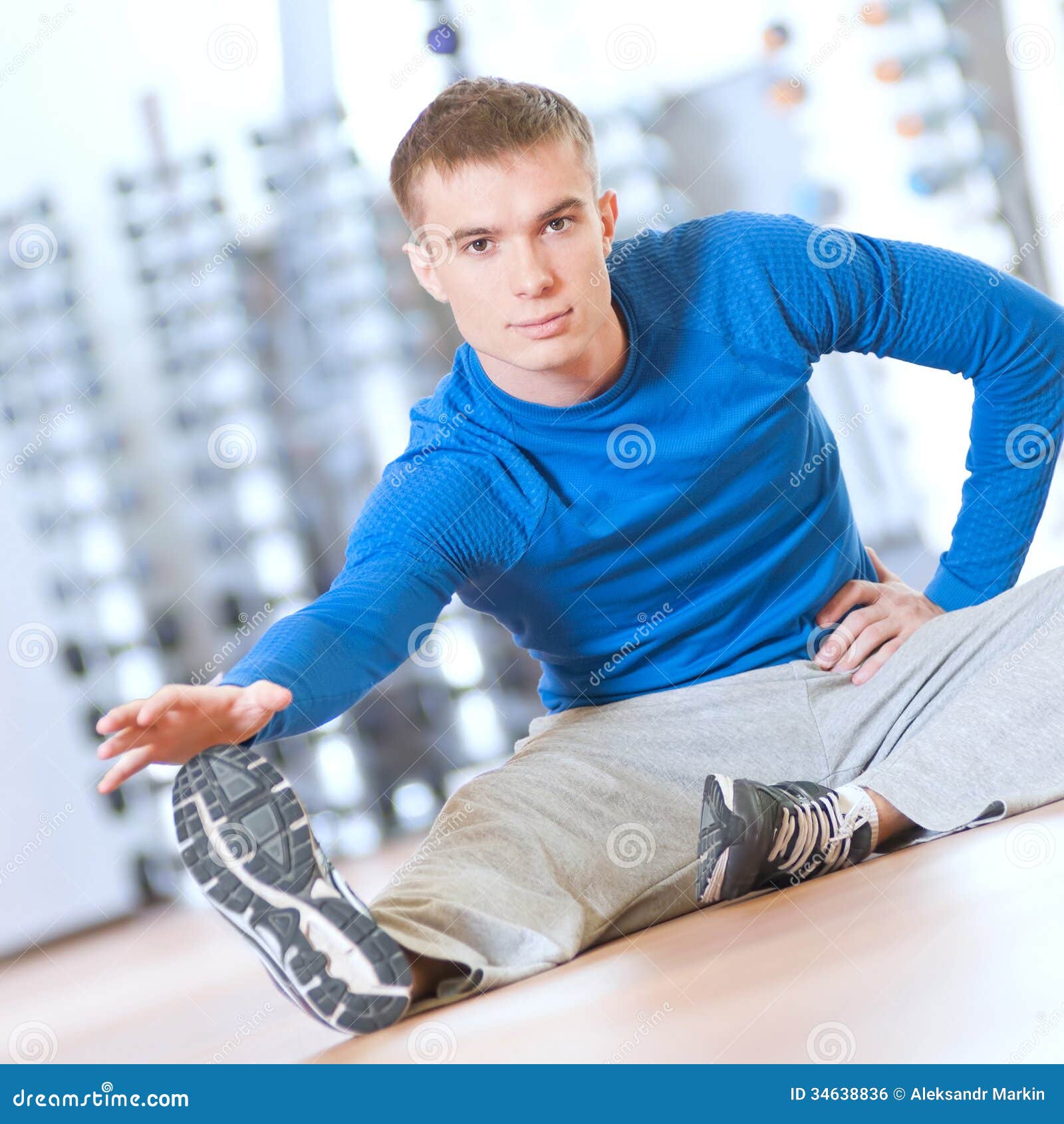 Man Doing Stretching Exercises at the Gym Stock Photo - Image of body ...
