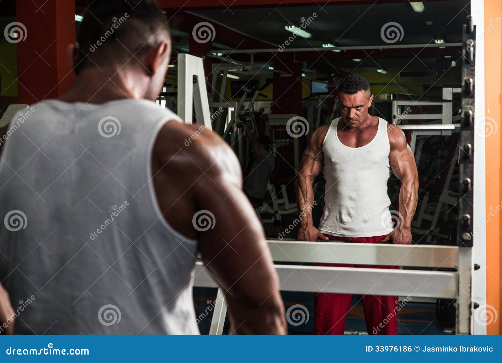 Man Doing Trap Exercises stock photo. Image of holding - 33976186