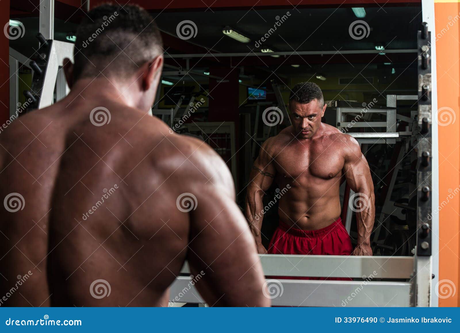 Man Doing Trap Exercises stock photo. Image of building - 33976490