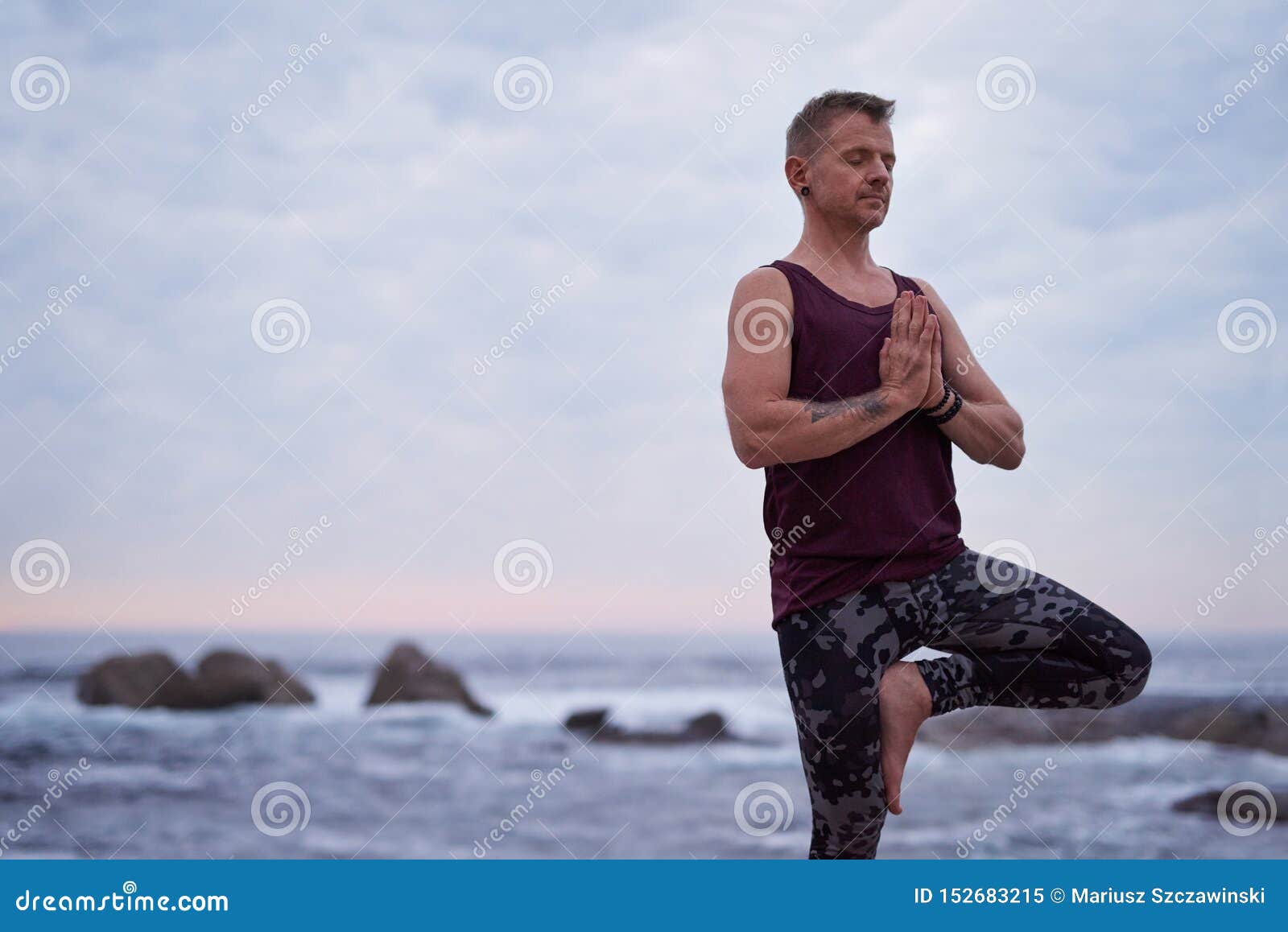 Man Doing the Tree Pose by the Ocean at Dusk Stock Image - Image of ...